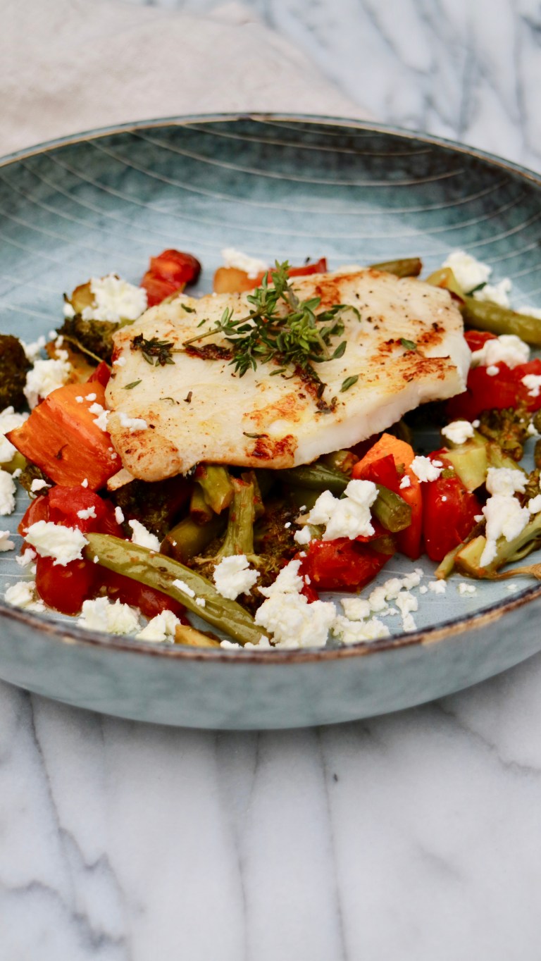 Fried Sheepshead fish on a green and red salad with Feta cheese ...