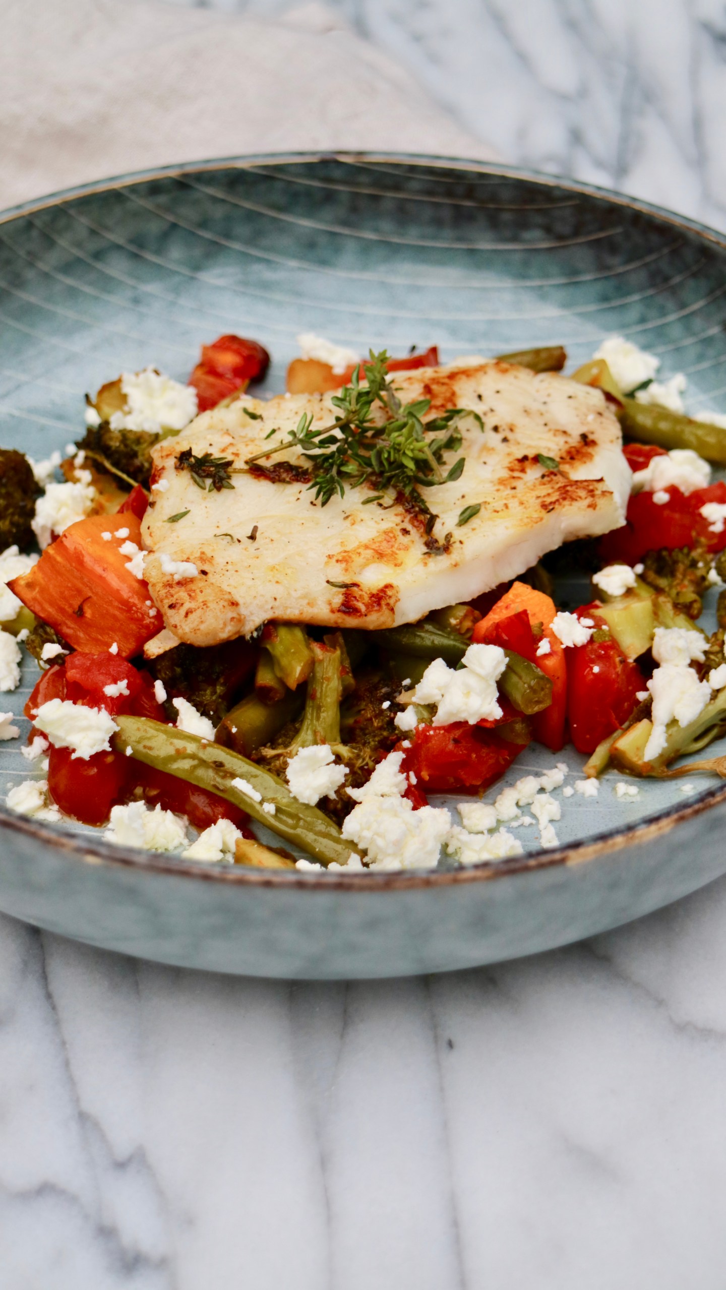 Fried Sheepshead fish on a green and red salad with Feta cheese ...