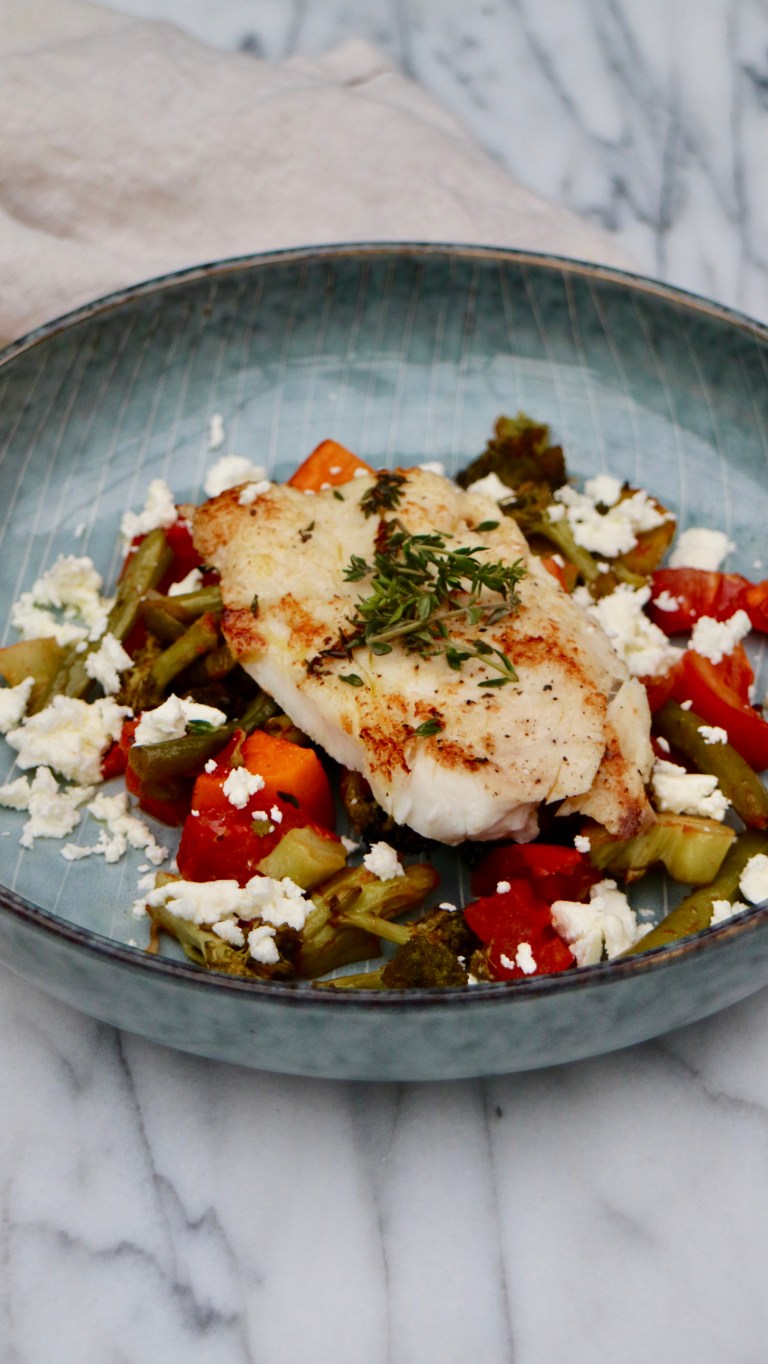 Fried Sheepshead fish on a green and red salad with Feta cheese ...